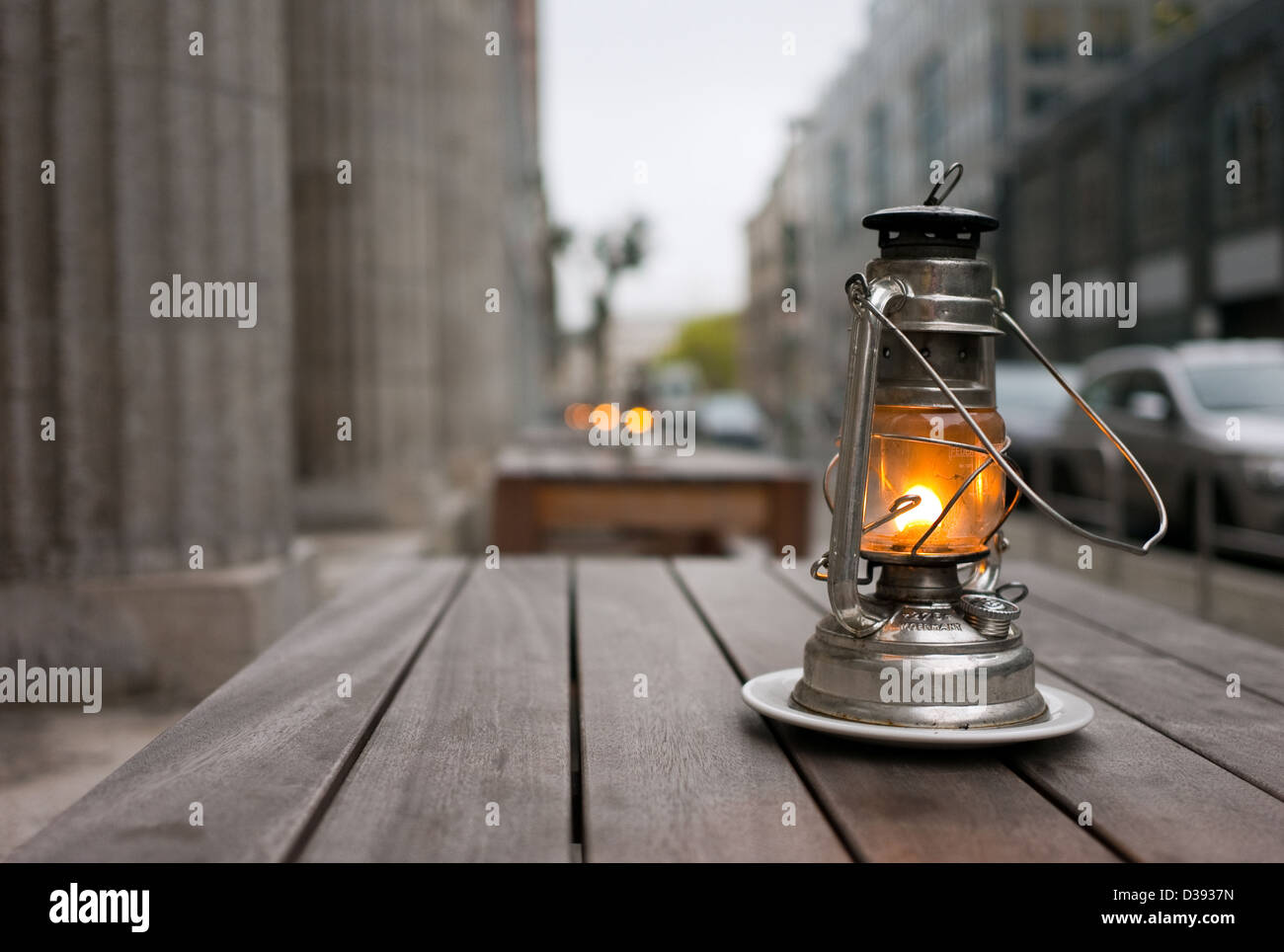 Berlin, Germany, kerosene lamps on an empty wooden tables Stock Photo ...