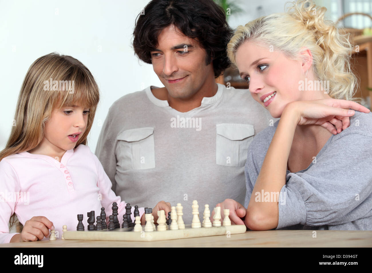 Family playing chess together Stock Photo - Alamy