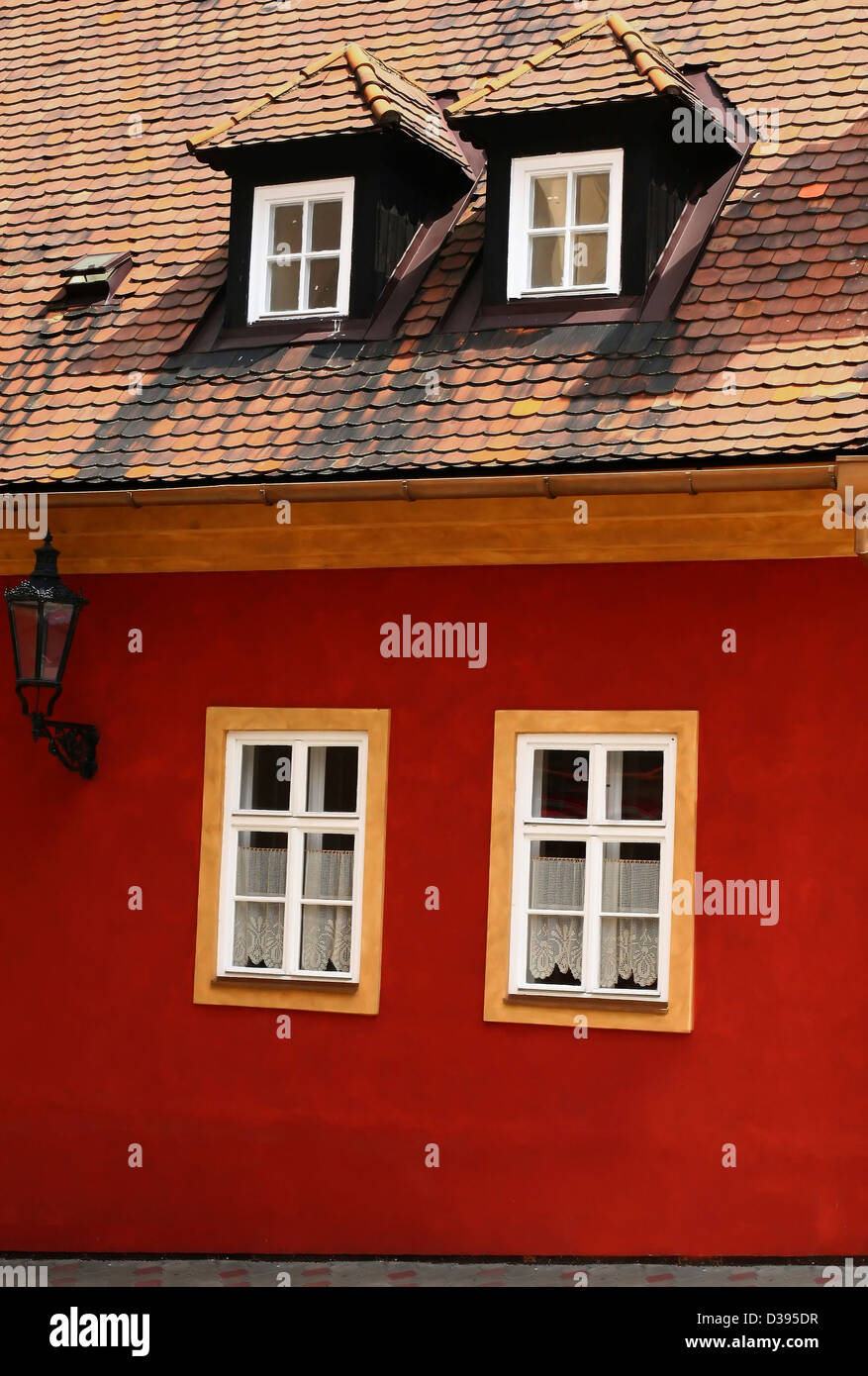 Roof, windows and red wall Stock Photo - Alamy