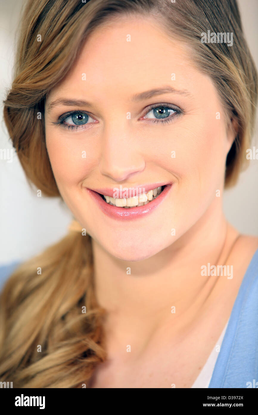 Smiling natural young woman Stock Photo - Alamy