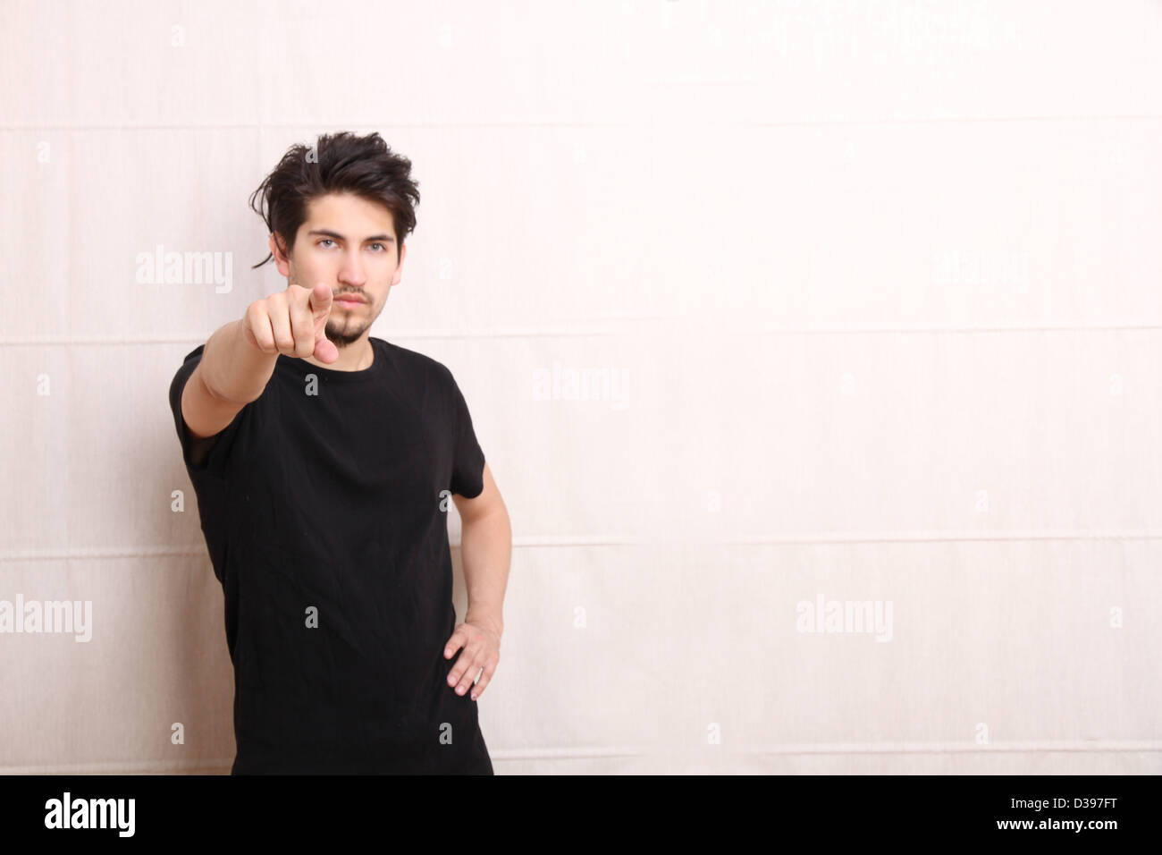 A young man pointing at you Stock Photo - Alamy