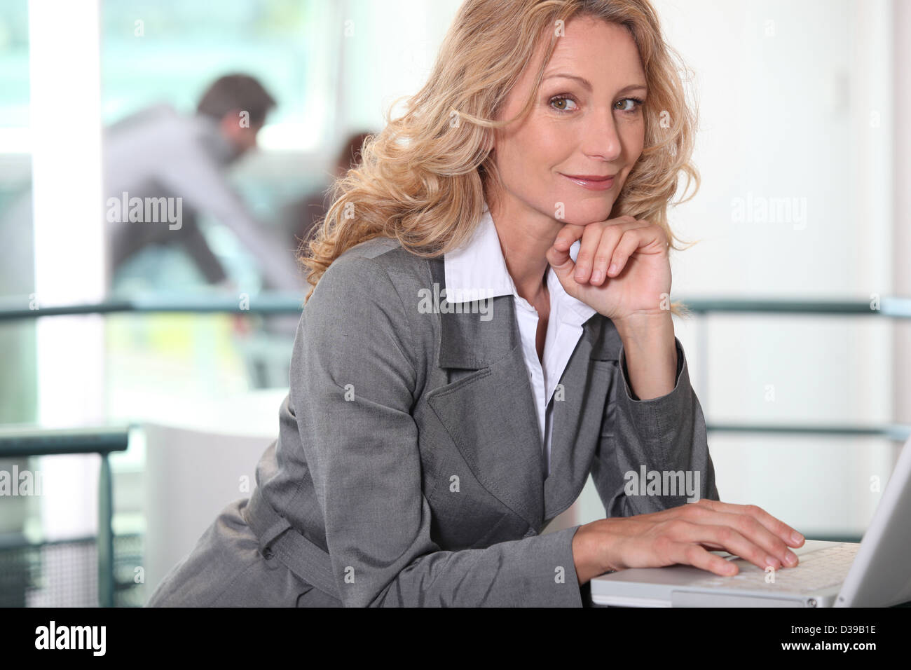 Attractive beautiful blue bright business businesspeople hi-res stock ...