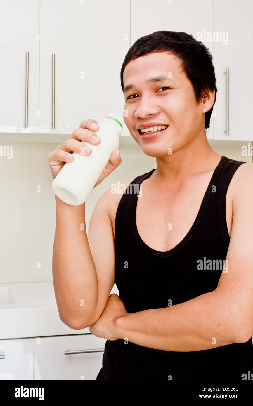 healthy young man drinking milk Stock Photo - Alamy