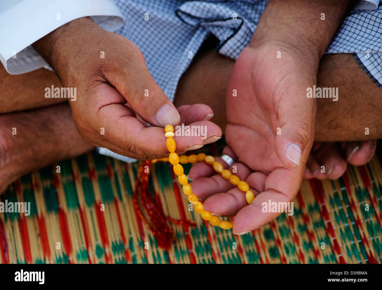 UAE Emirate of Dubai man praying Stock Photo - Alamy