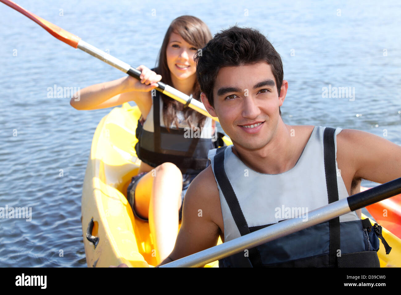 Couple in yellow canoe hi-res stock photography and images - Alamy