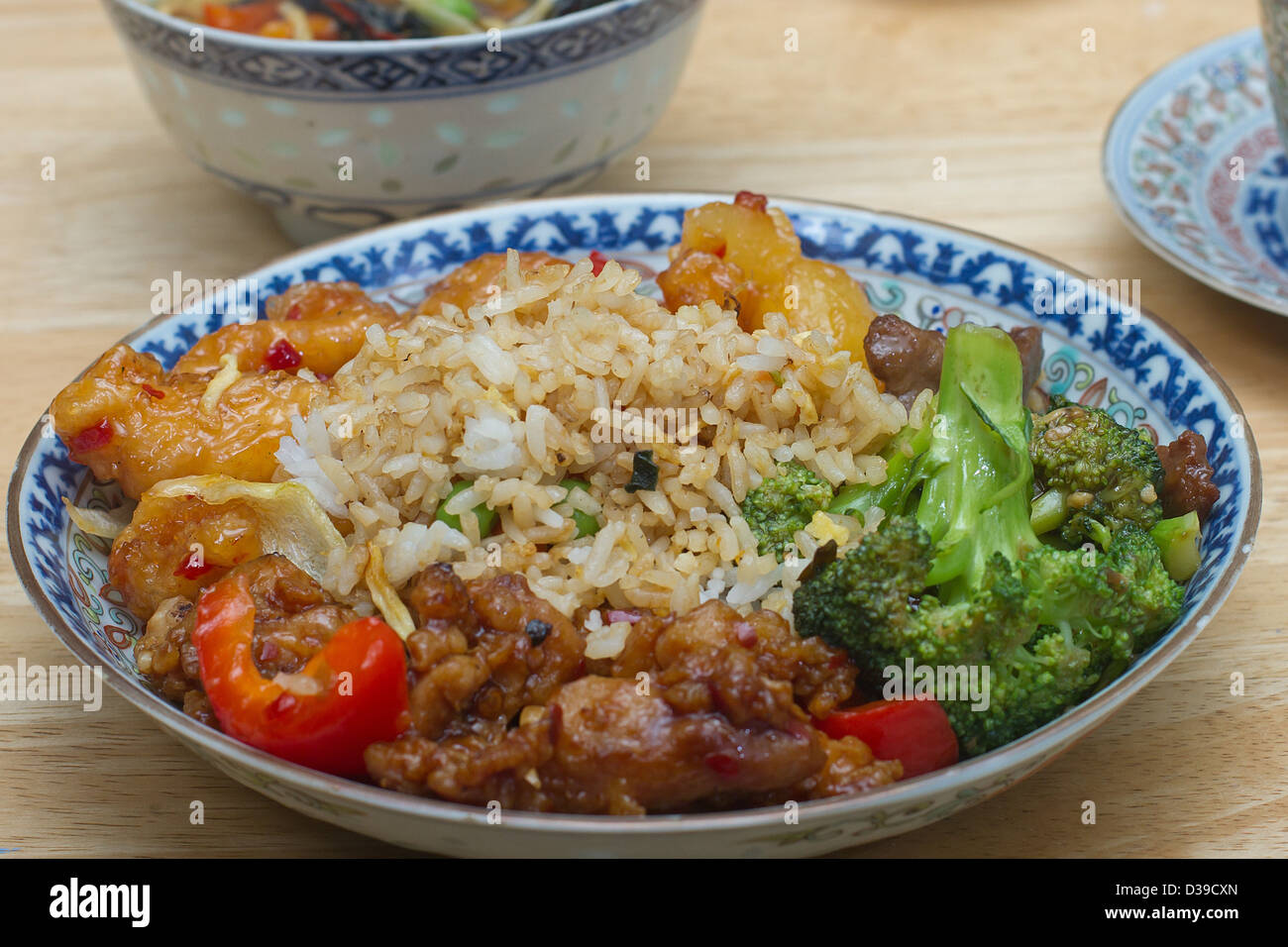 Traditional Chinese food on rice china pattern plates Stock Photo - Alamy