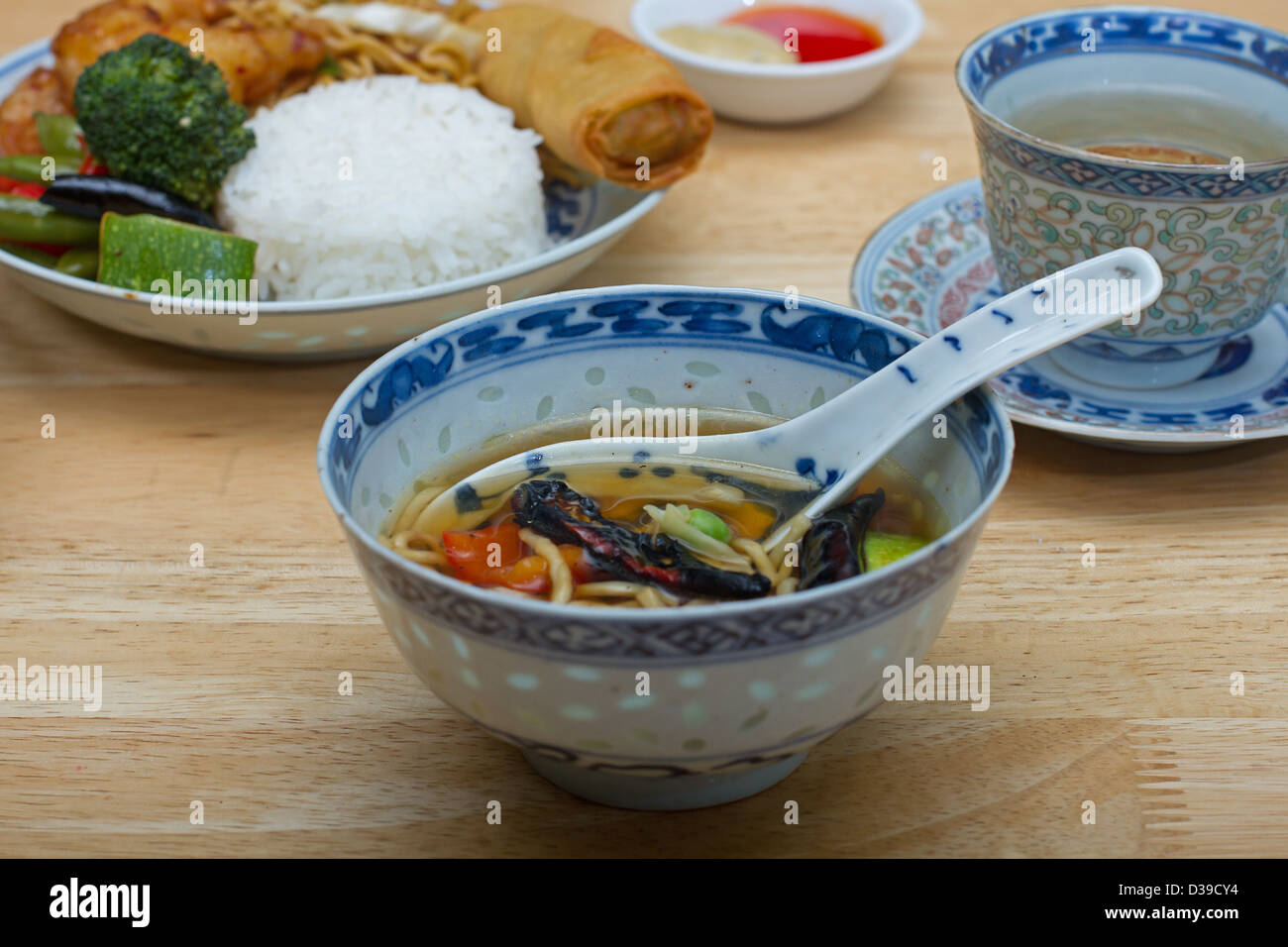 Traditional Chinese food on rice china pattern plates Stock Photo - Alamy