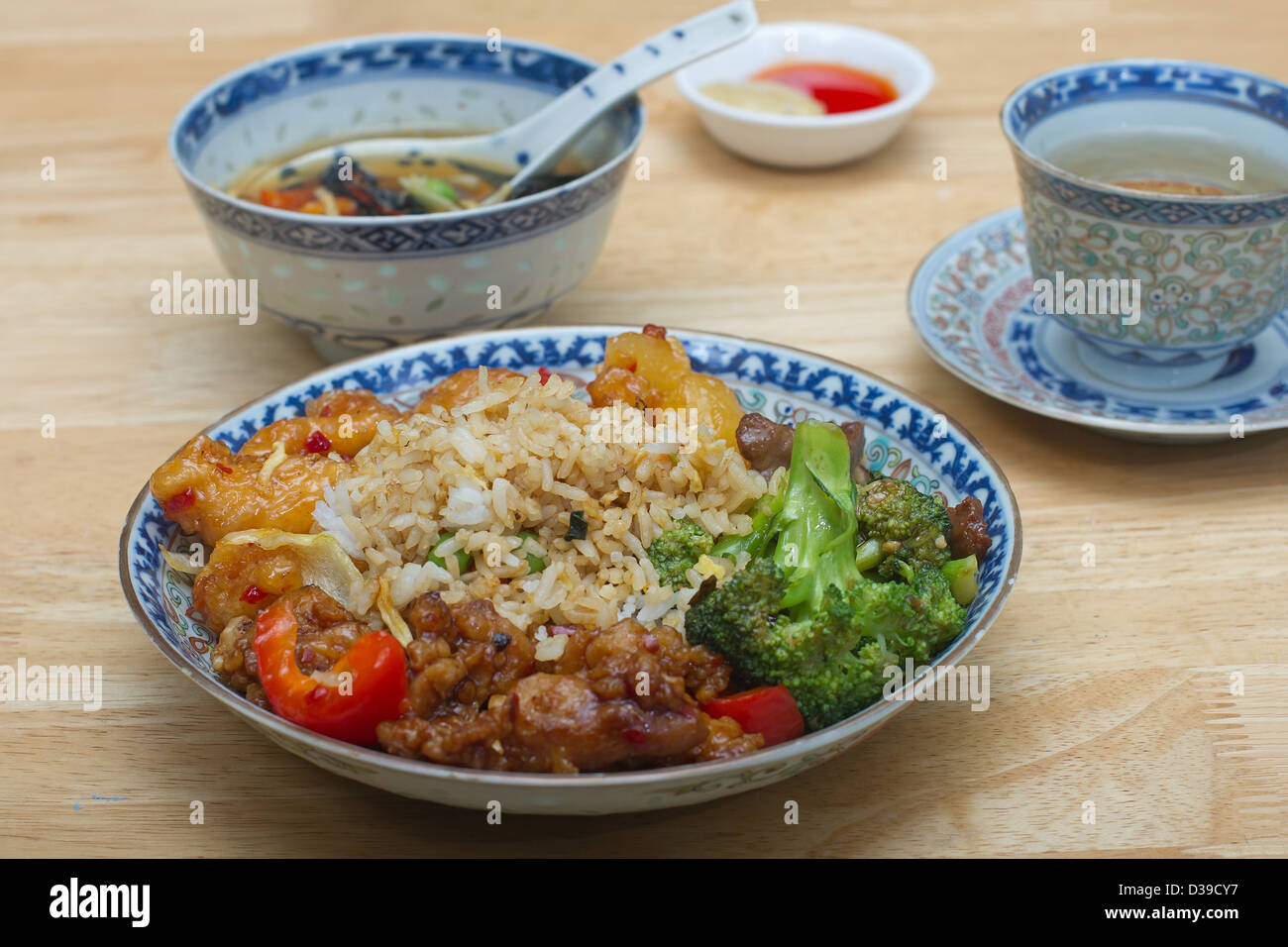 Traditional Chinese food on rice china pattern plates Stock Photo - Alamy