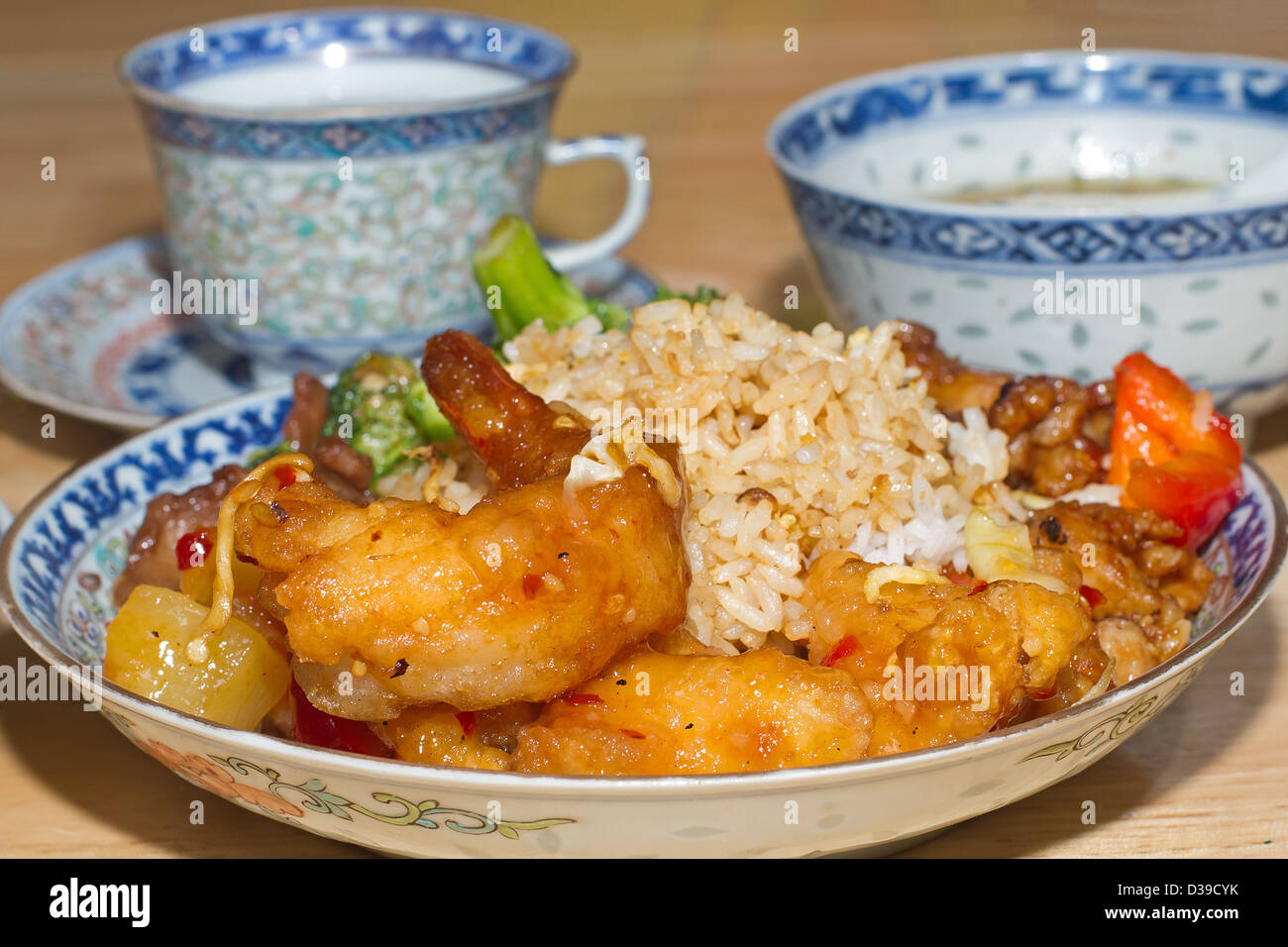 Traditional Chinese food on rice china pattern plates Stock Photo - Alamy