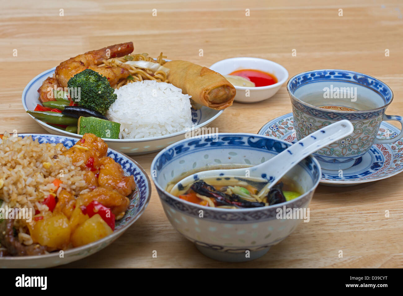 Traditional Chinese food on rice china pattern plates Stock Photo - Alamy