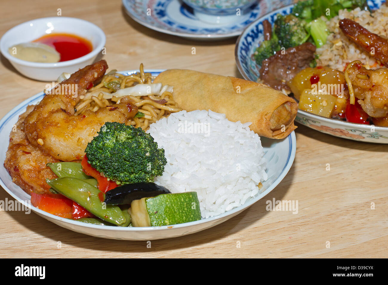 Traditional Chinese food on rice china pattern plates Stock Photo - Alamy