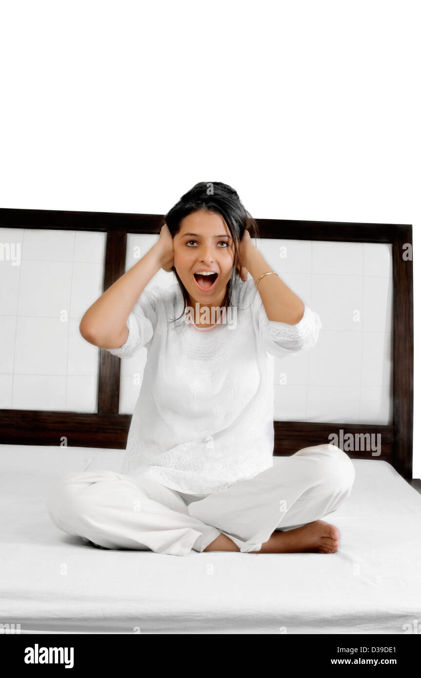 lady sitting on the bed Stock Photo - Alamy