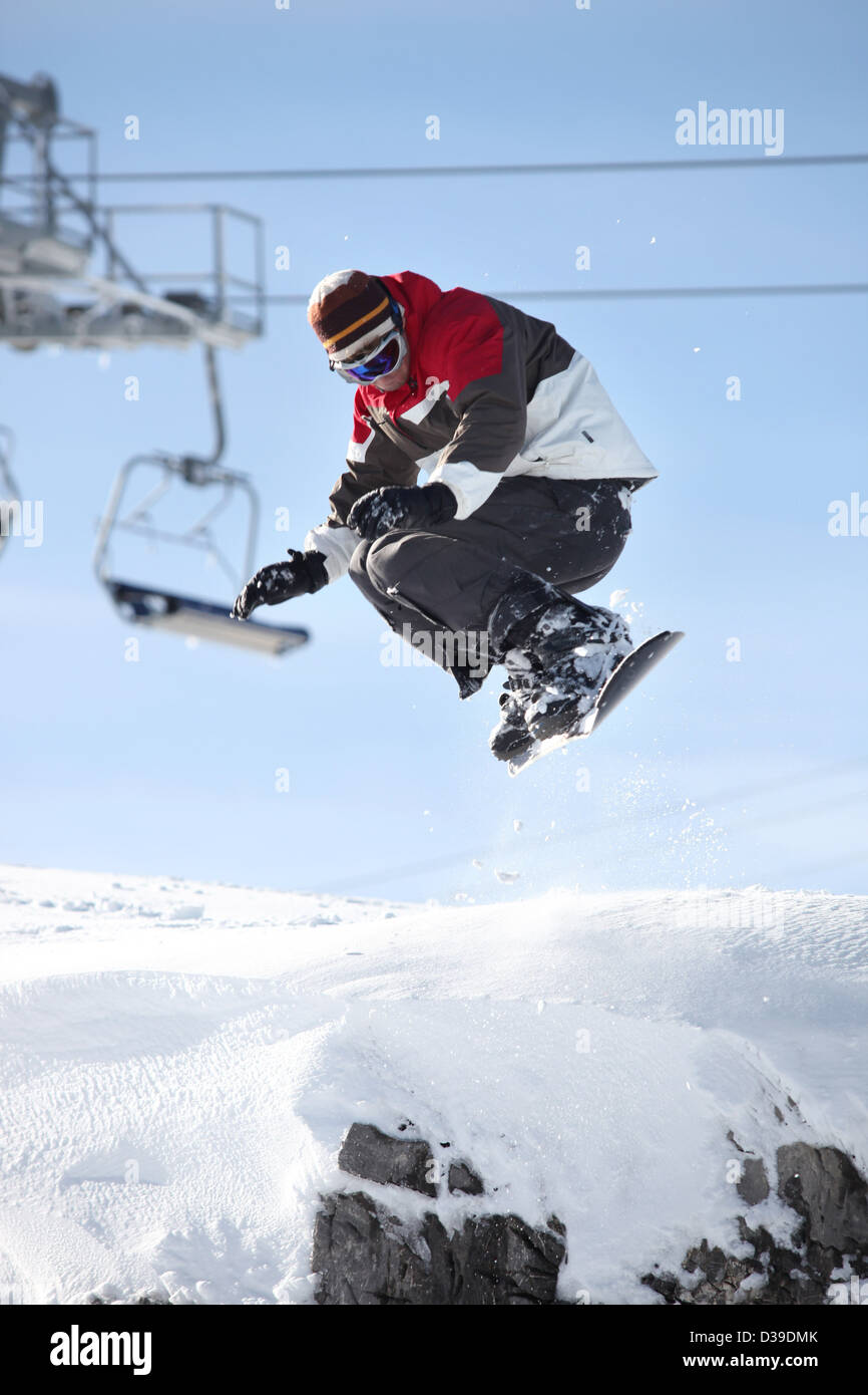 A snowboarder in mid-air Stock Photo - Alamy