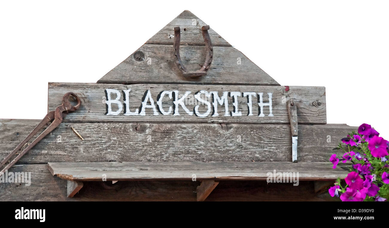 Old sign with word blacksmith on rustic wood boards and rusty old ...
