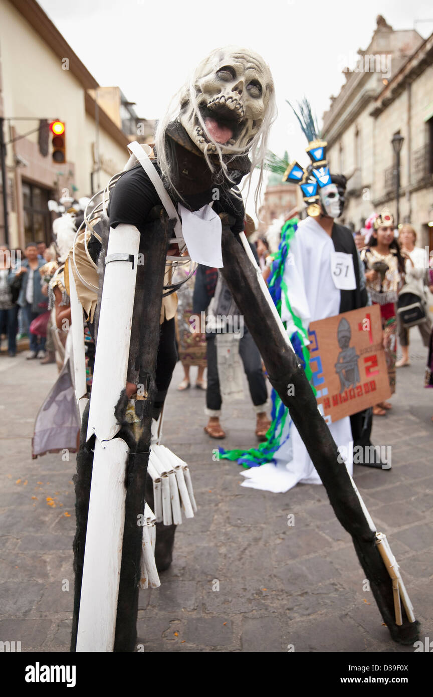 Person in skeleton costume on stilts in Day of the Dead parade, Oaxaca ...