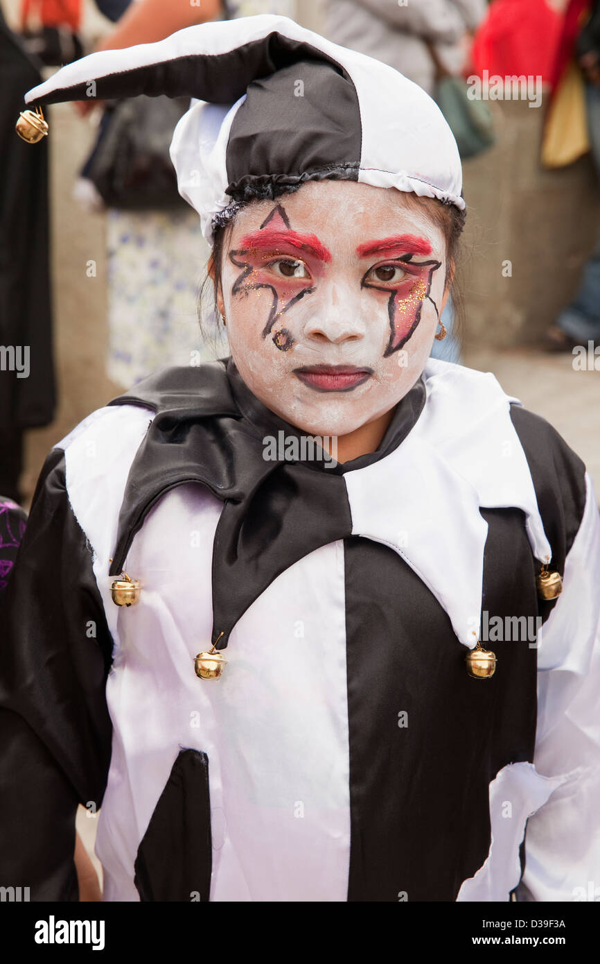 Young girl dressed as a jester for Day of the Dead children's parade ...
