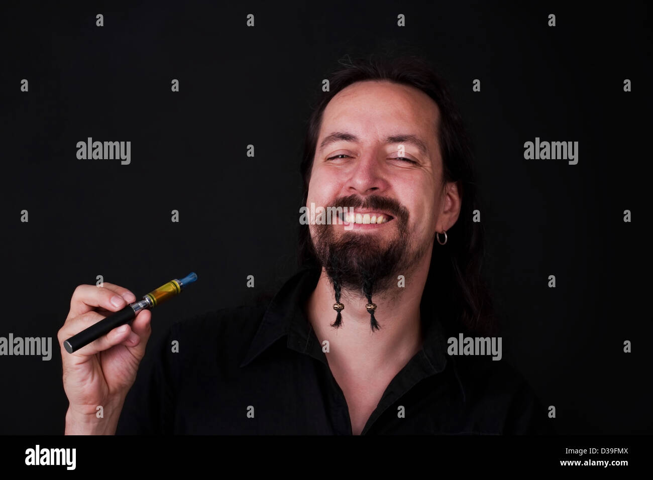 Friendly handsome man with electric cigarette is smiling Stock Photo ...