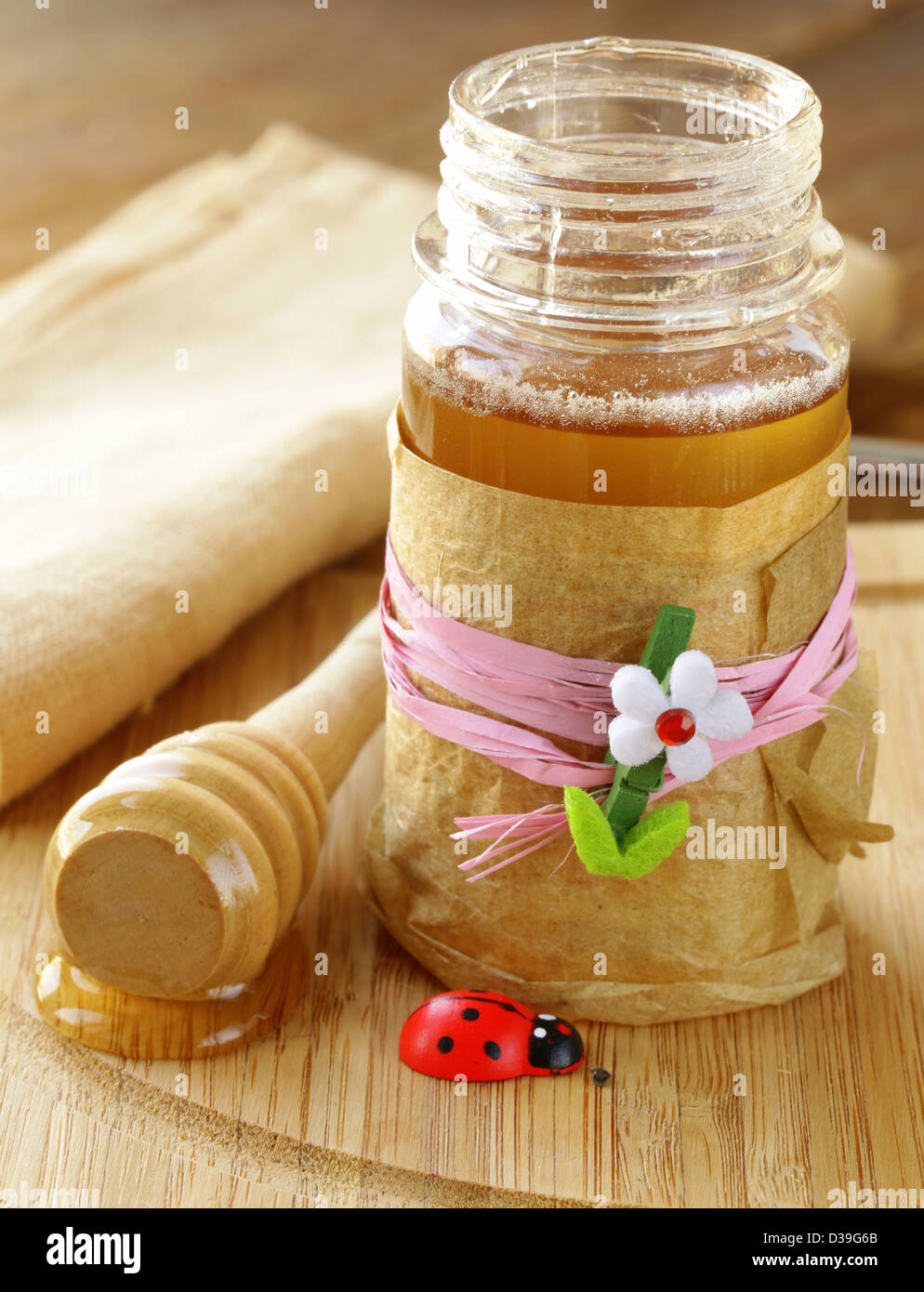 Natural organic flower honey in the pot Stock Photo - Alamy
