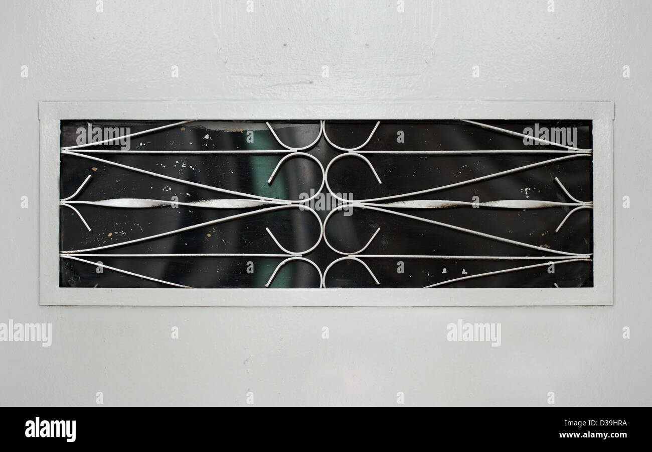 windows with iron grating in a wall Stock Photo - Alamy