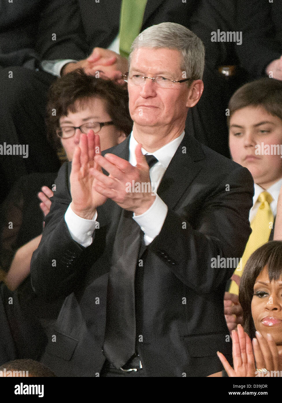 Tim Cook, CEO, Apple, Inc., applauds as United States President Barack ...