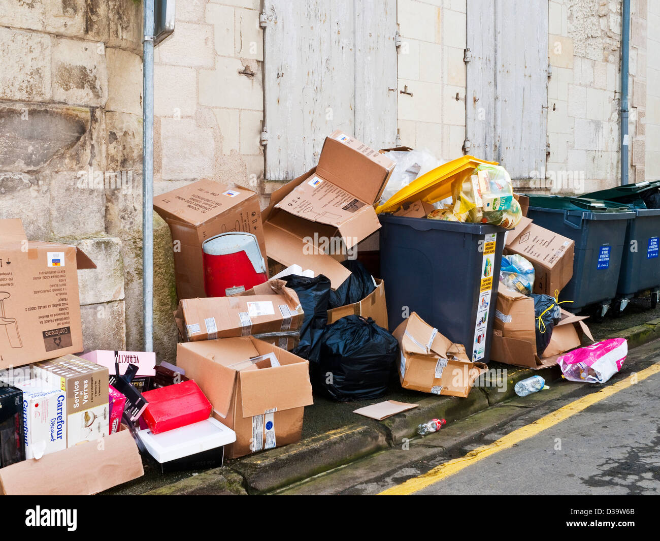 Overflowing rubbish bins awaiting collection - France Stock Photo - Alamy
