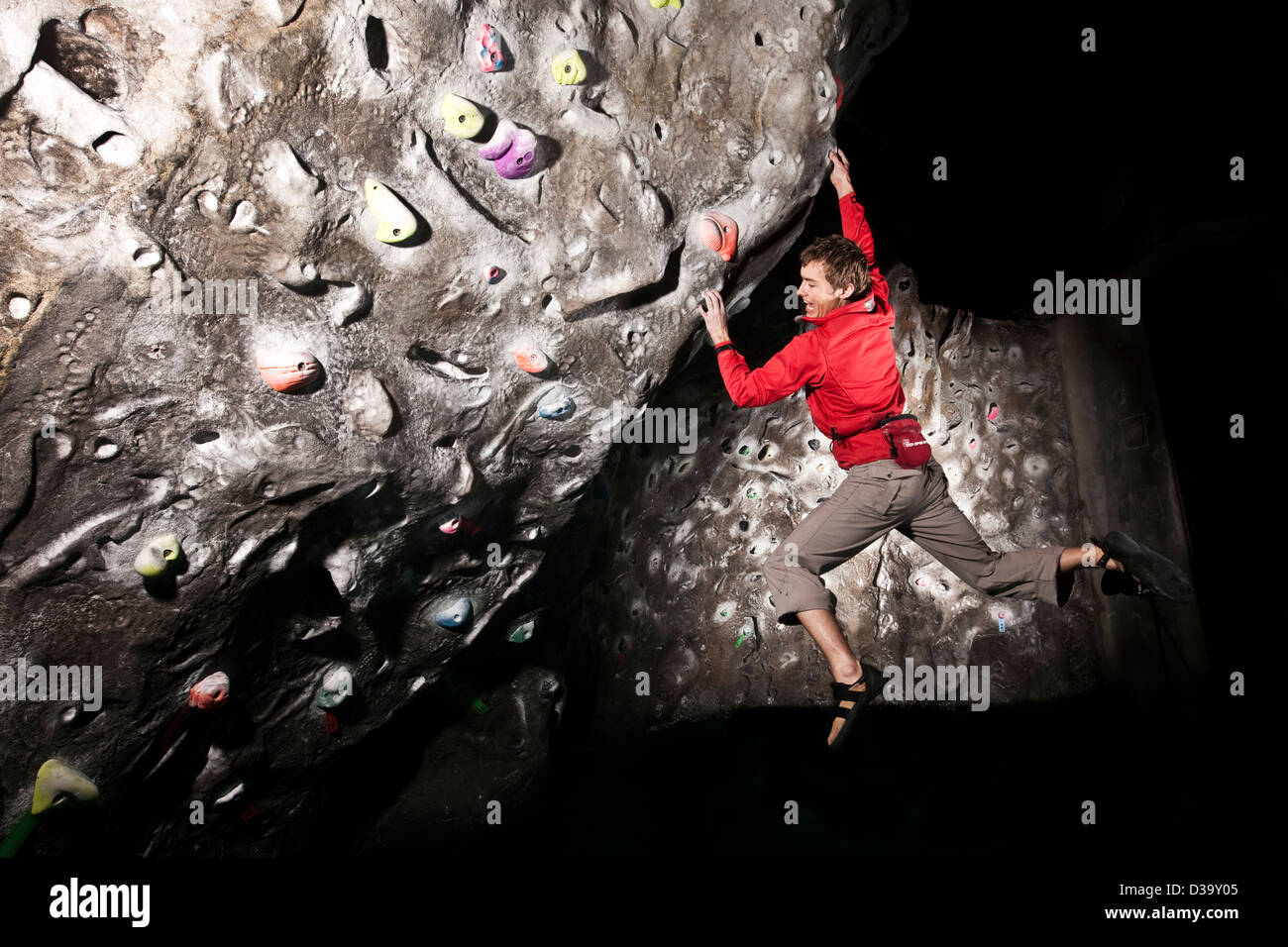 Rock climber on climbing wall, low angle Stock Photo - Alamy