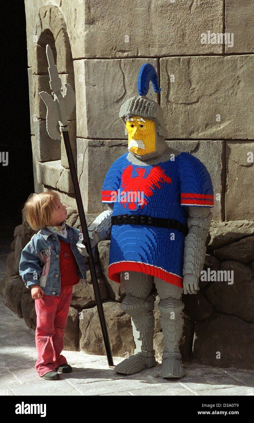 (dpa) - A child looks up to a castle guard made of Lego bricks at the ...