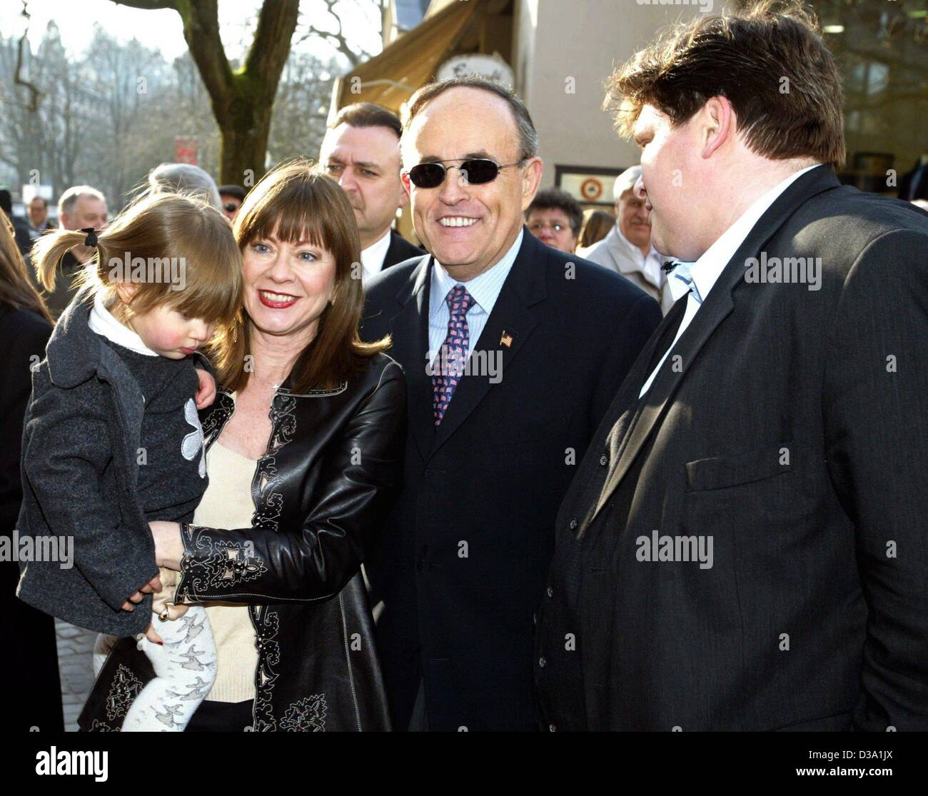 Rudolph Giuliani (C), the former mayor of New York, smiles as his ...