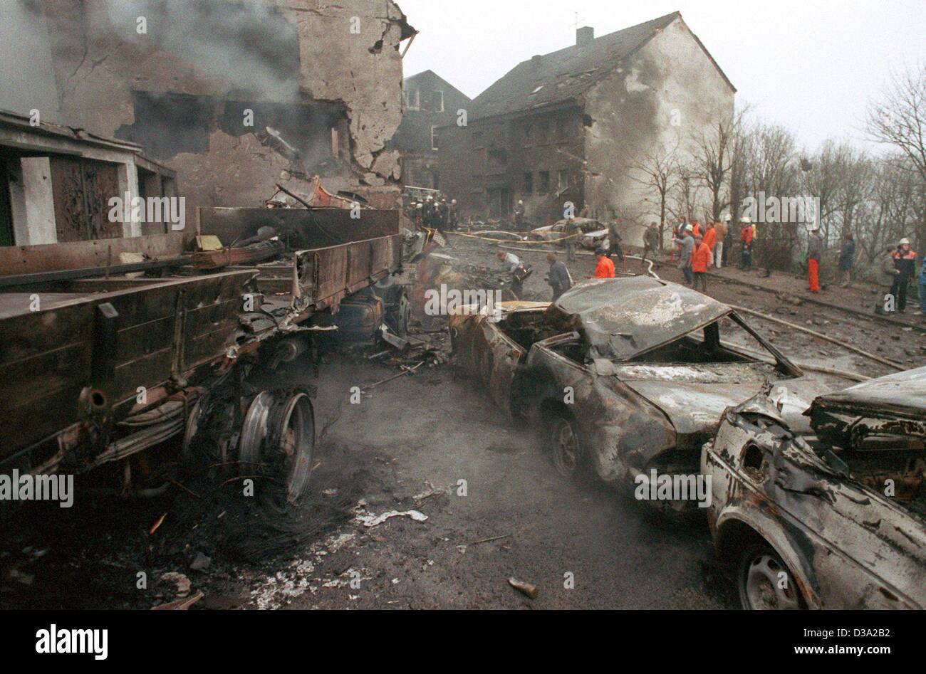 Burnt-out houses and destroyed cars, after an US military jet "A 10 ...