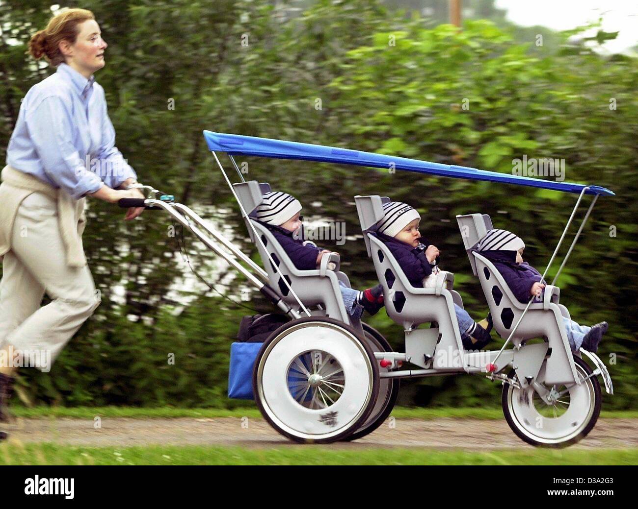 Triplets babies in pram hi-res stock photography and images - Alamy
