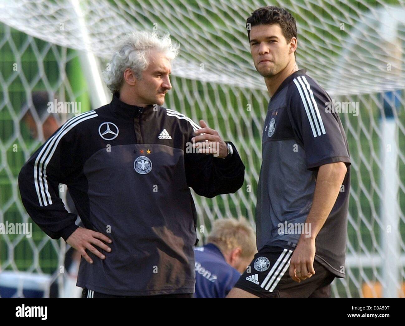 (dpa) - German soccer coach Rudi Voeller talks to his midfield player ...