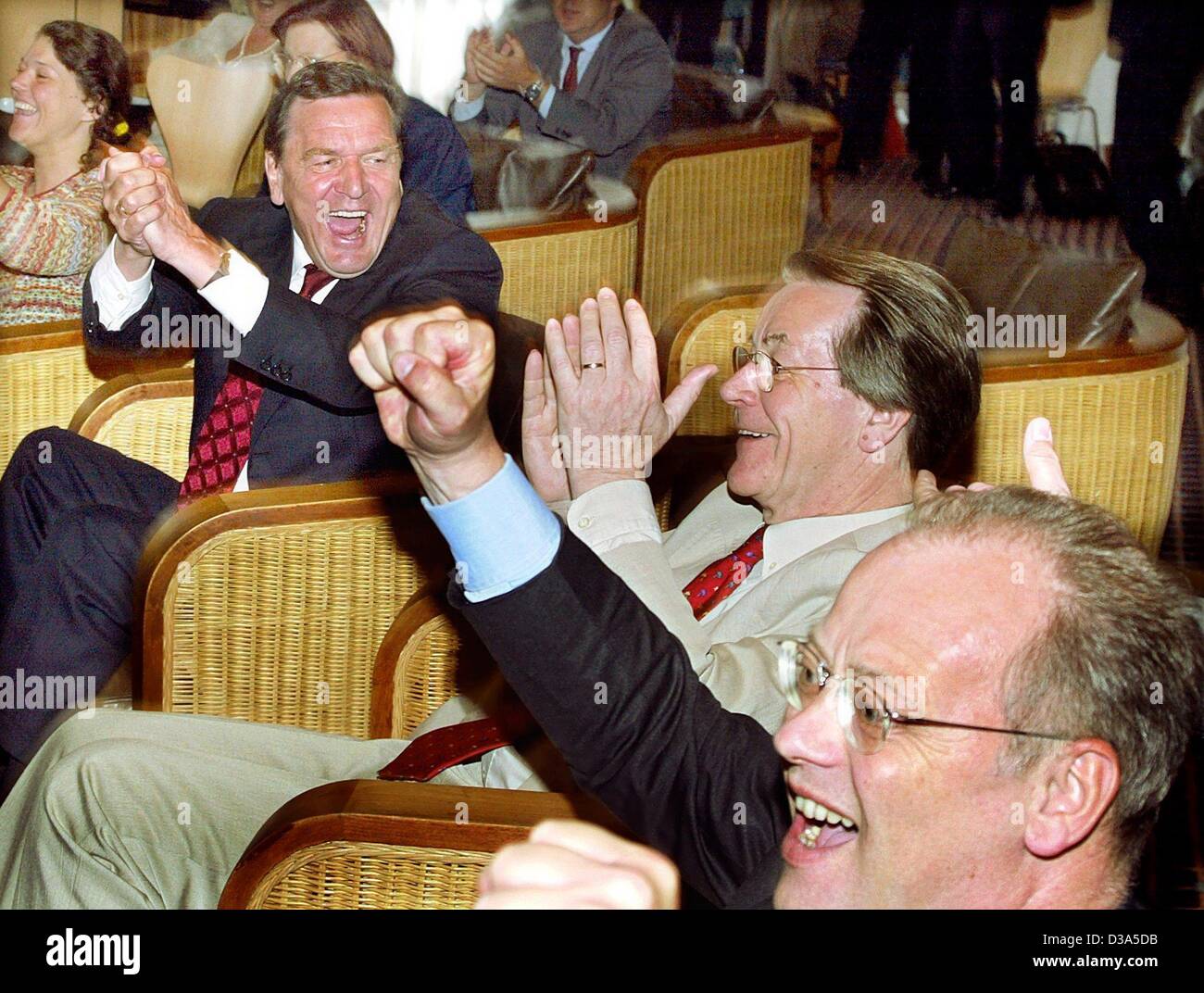 (dpa) - German politicians cheer as they watch the FIFA 2002 World Cup ...