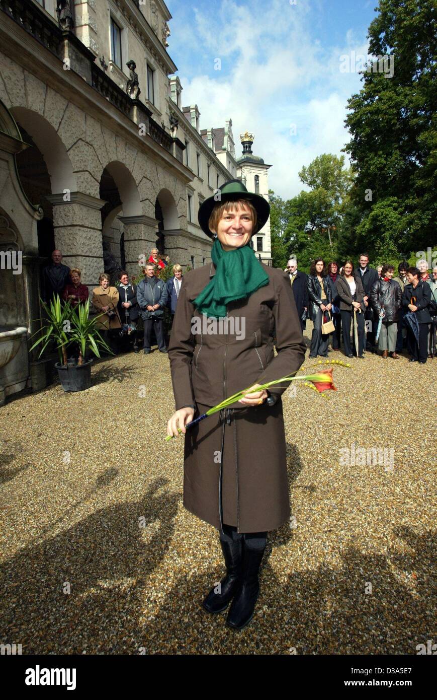 (dpa) - Princess Gloria von Thurn und Taxis poses with a flower in her ...