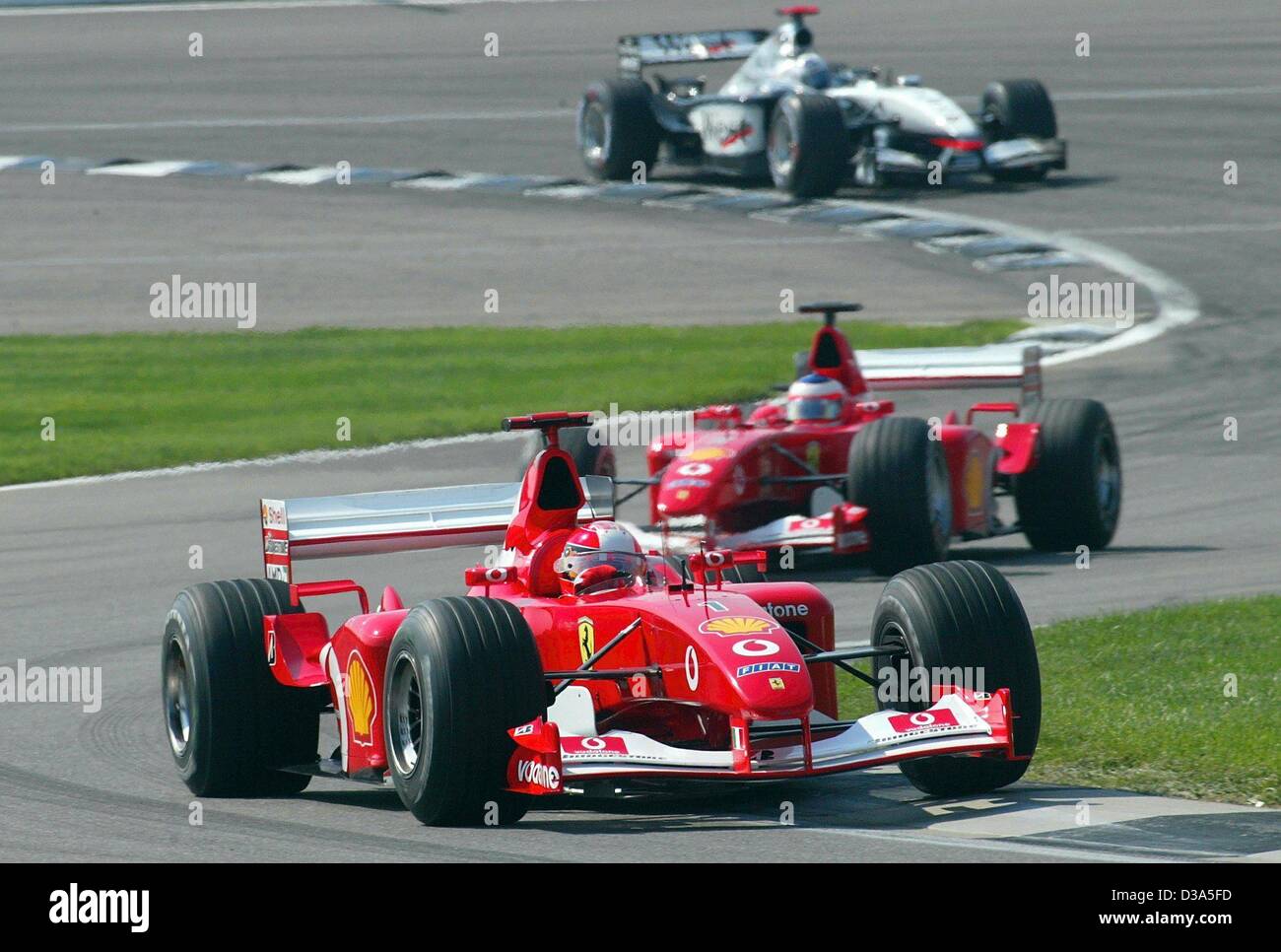 (dpa) - Michael Schumacher (front), German formula one pilot (Ferrari ...