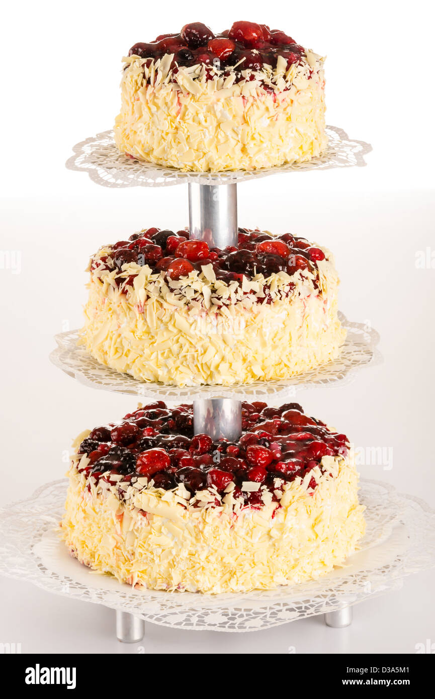 Three-story cake almond with red berries wedding celebration dessert ...