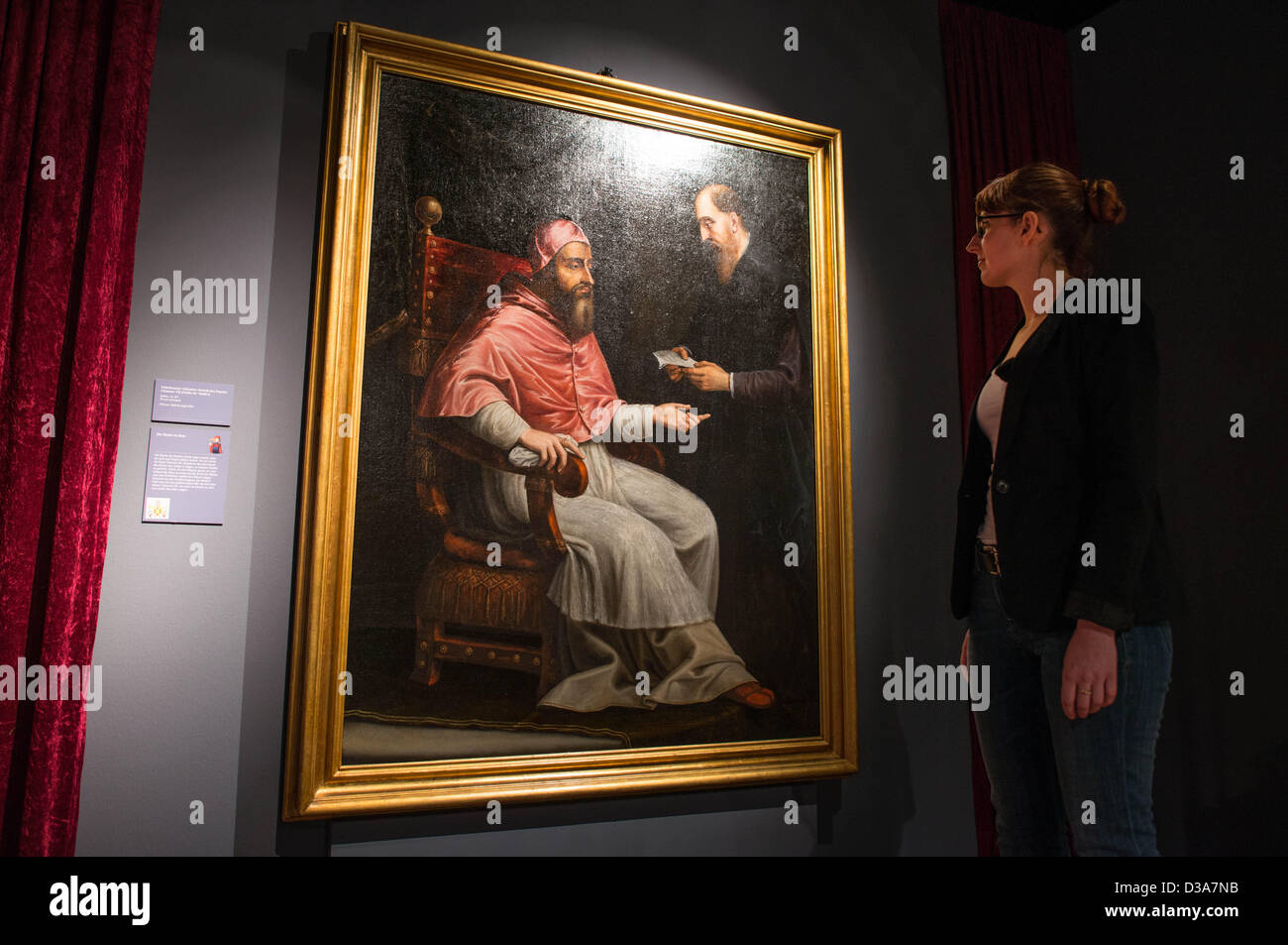 A woman looks at a painting of Pope Clemens VII. (1478 - 1534) at the ...