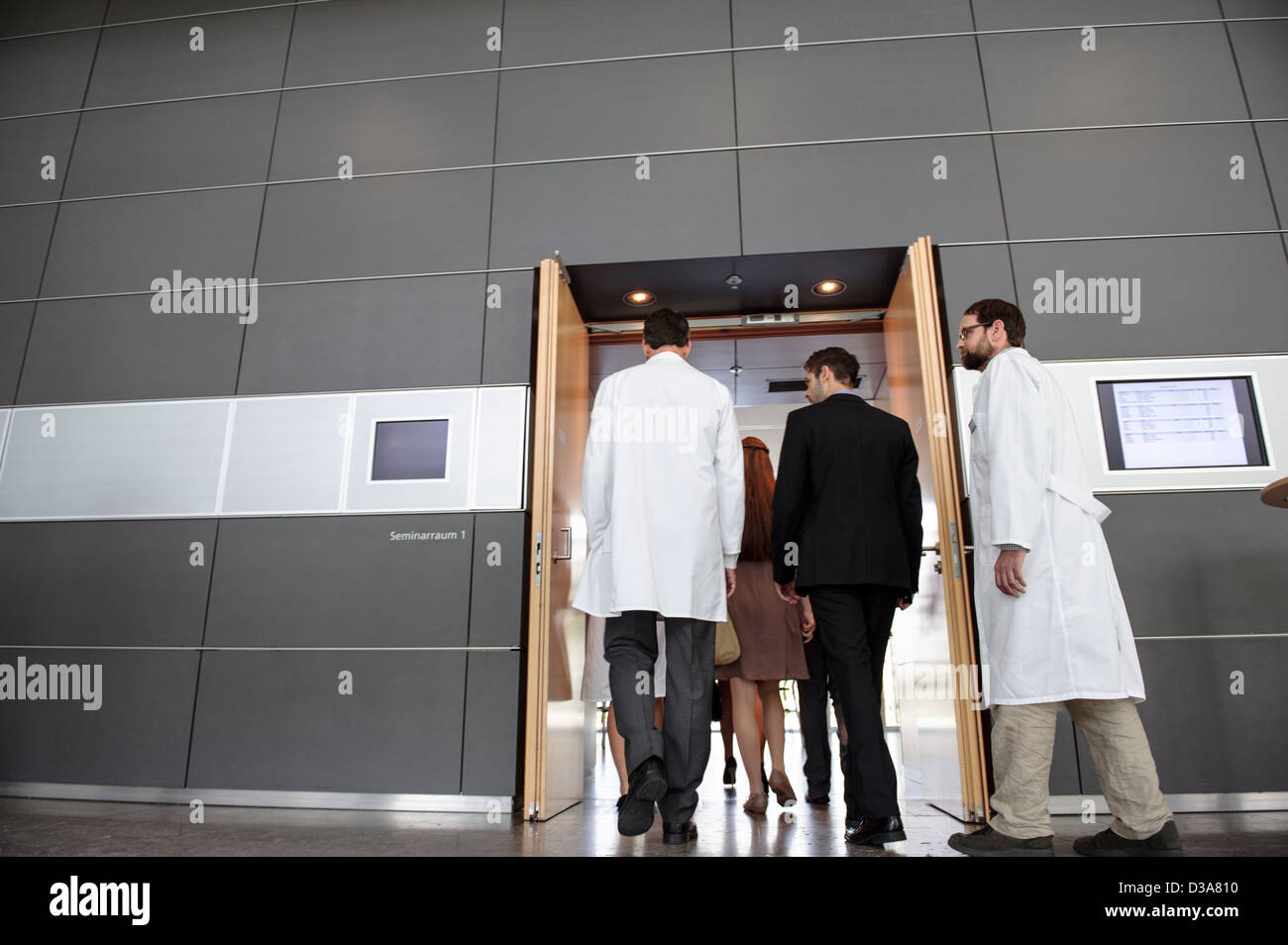 Group business people entering office hi-res stock photography and ...