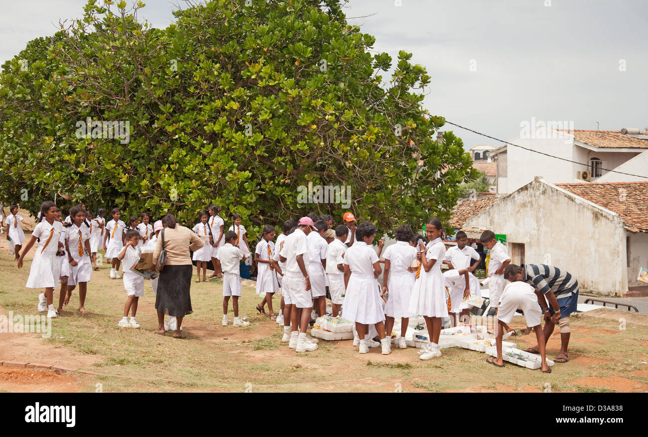 School students on a school trip to Galle Fortress. They are choosing ...