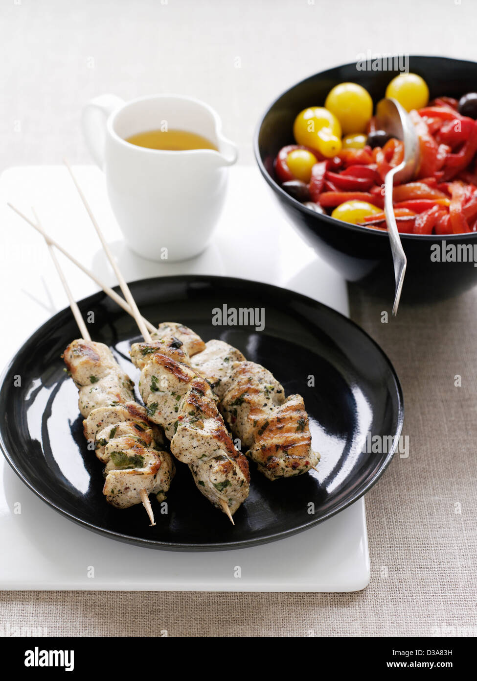 Plate of quail kebabs with vegetables Stock Photo - Alamy