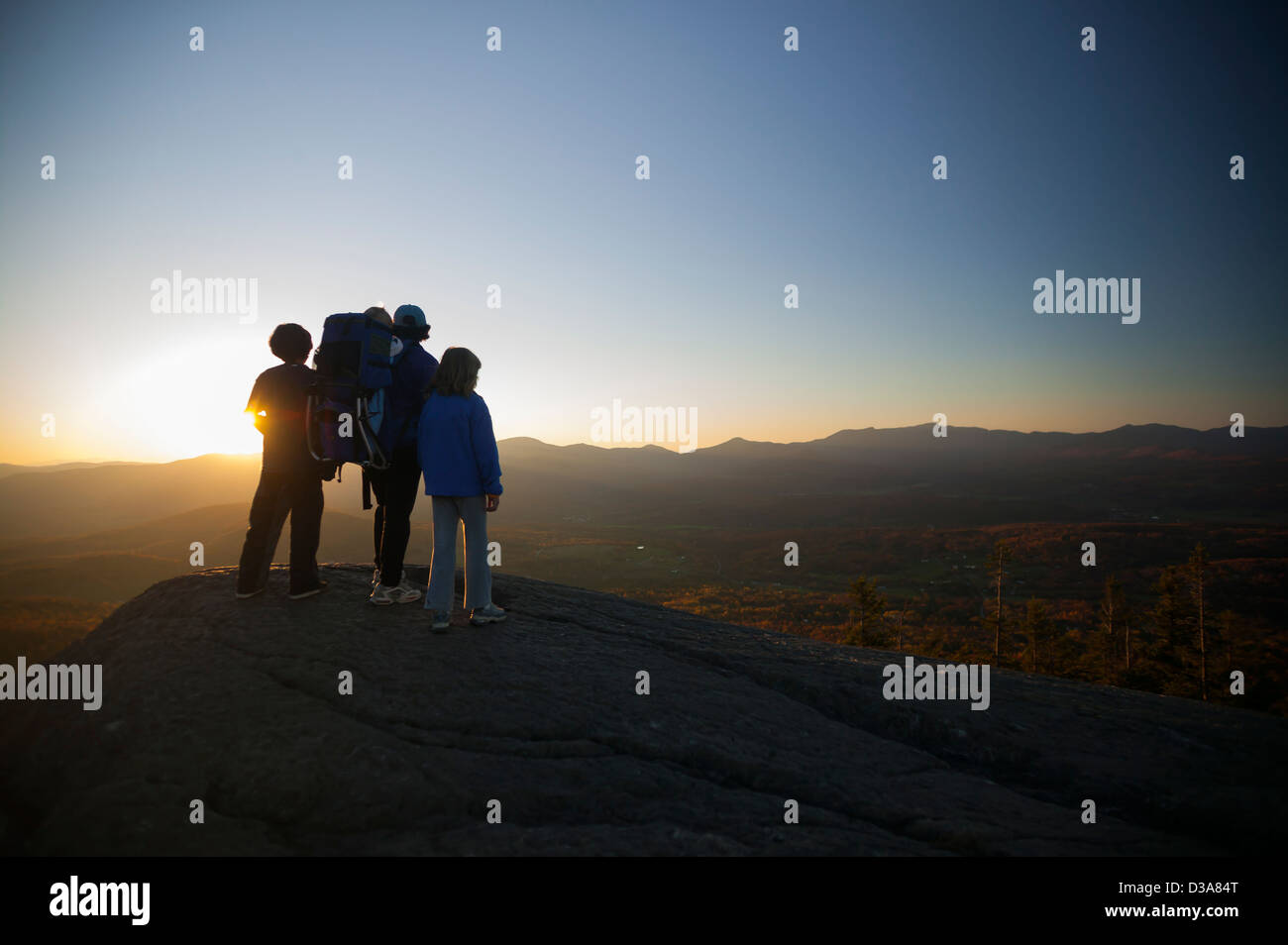 Family watching sunset on top of The Pinnacle, Stowe, Vermont, USA ...