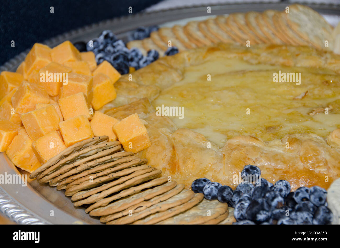 Belize. Tray of appetizers including blueberries, baked brie, cheddar ...