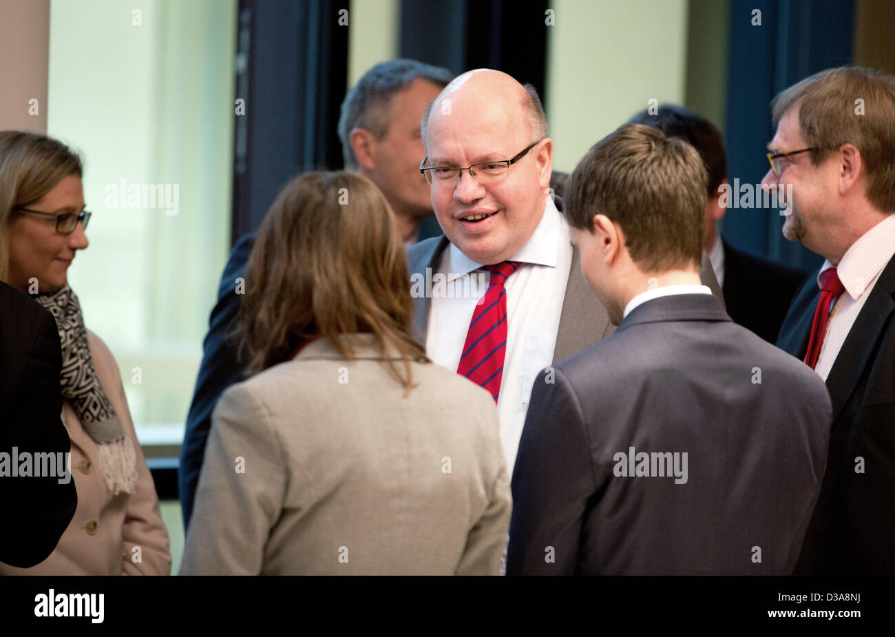 German Environment Minister Peter Altmaier (C) welcomes his ...