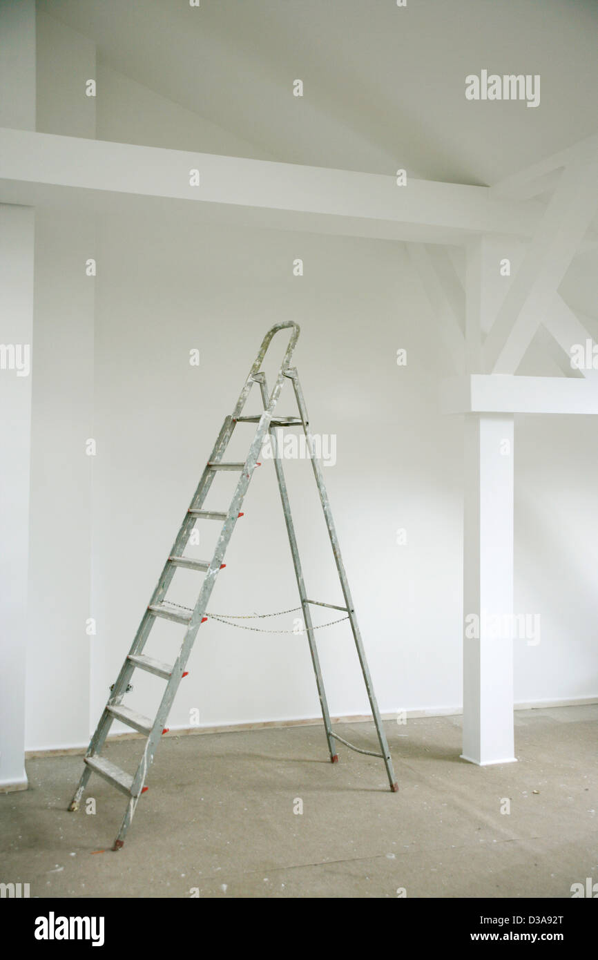 Metal ladder in empty house Stock Photo - Alamy