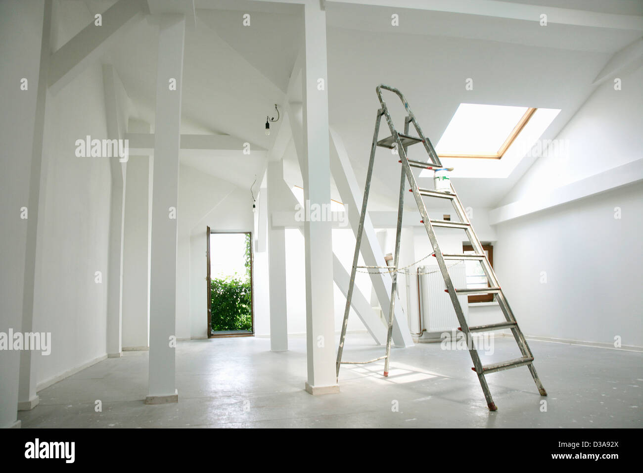 Metal ladder in empty house Stock Photo - Alamy