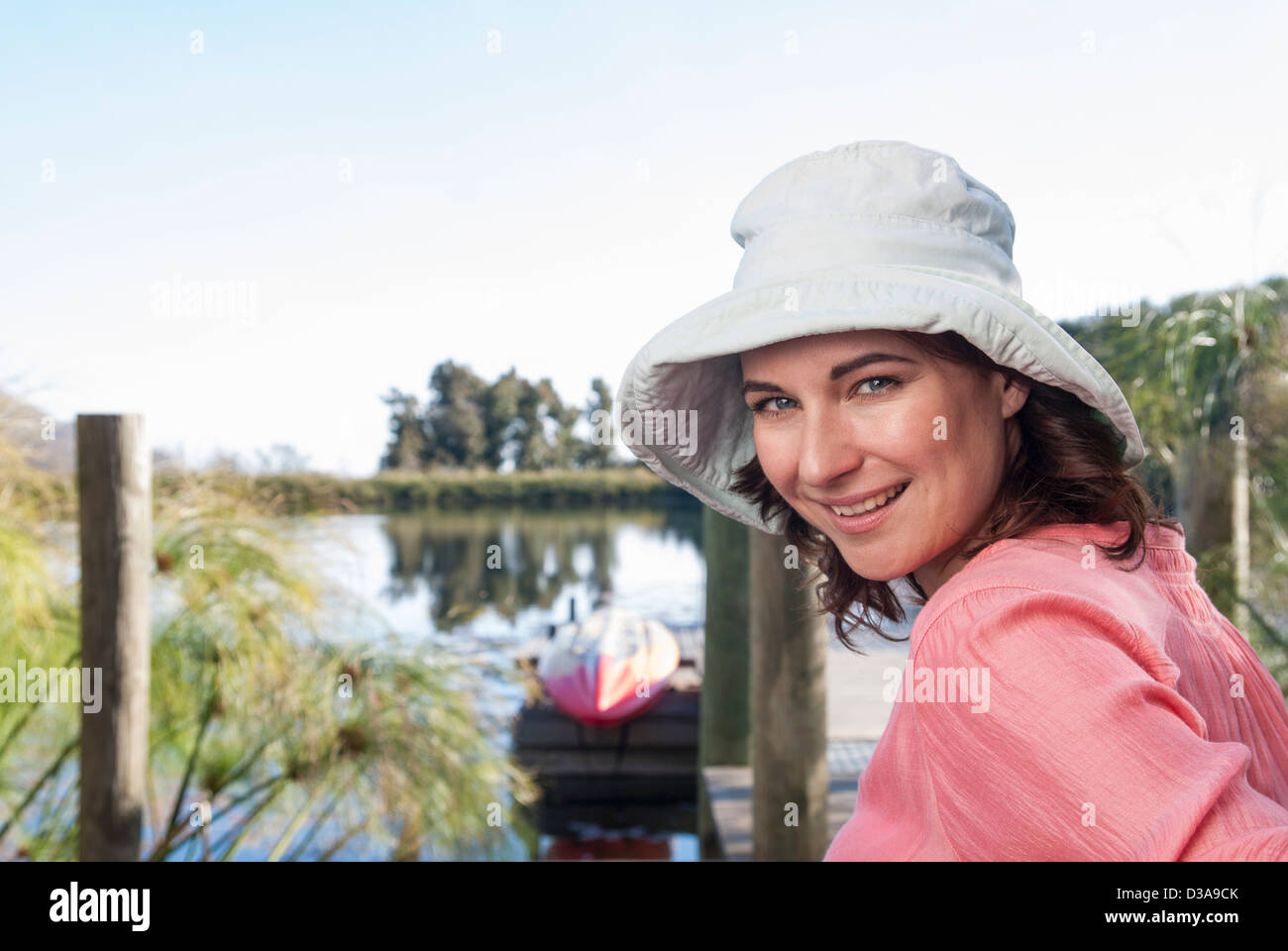 Seated smiling exterior hi-res stock photography and images - Alamy