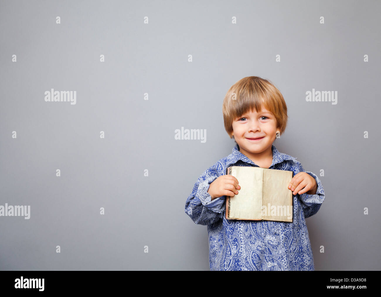 little boy holding an open book Stock Photo - Alamy