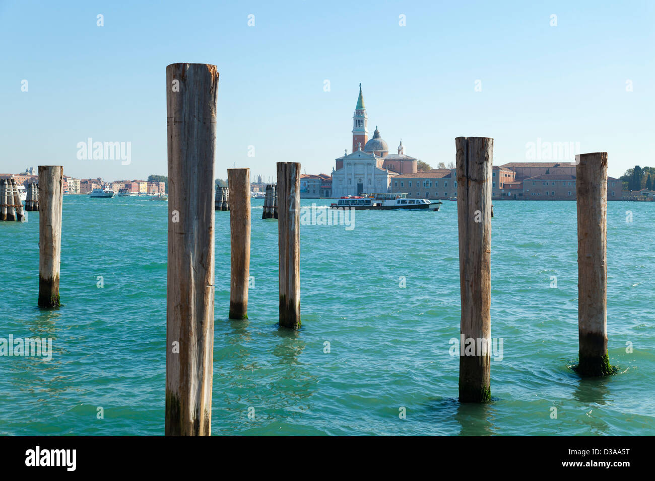 Wooden posts in urban harbor Stock Photo - Alamy