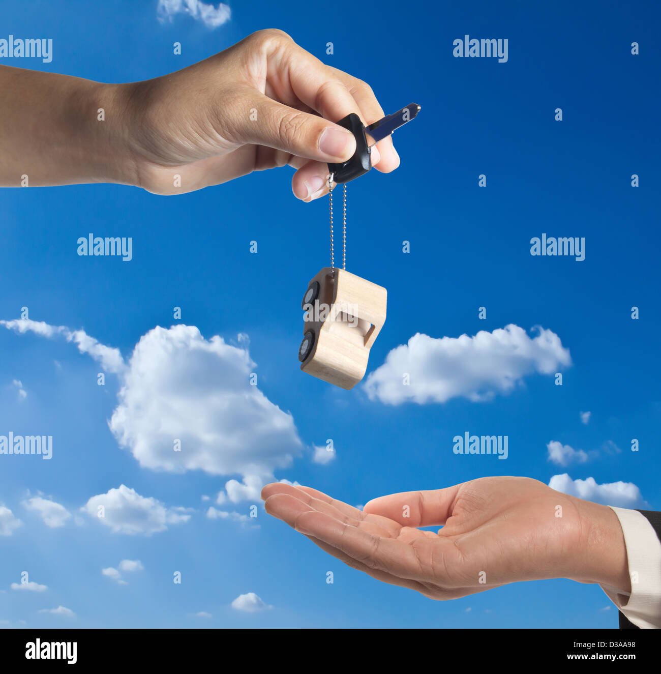 Car-key exchange with blue sky background Stock Photo - Alamy