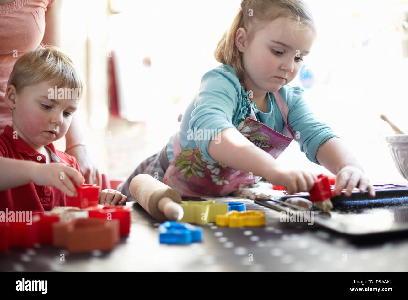 Children playing with shapes on table Stock Photo - Alamy