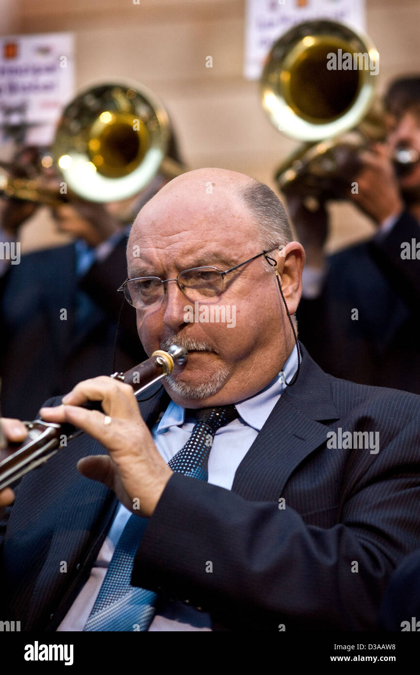 A musician of the band "La Principal de la Bisbal" play for a Sardana ...